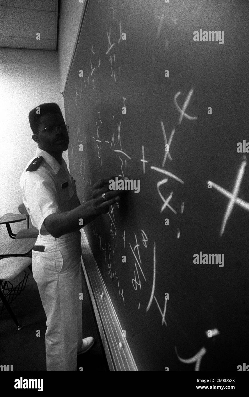 Midshipman Miles Brooks, a member of the ROTC program, solves an ...