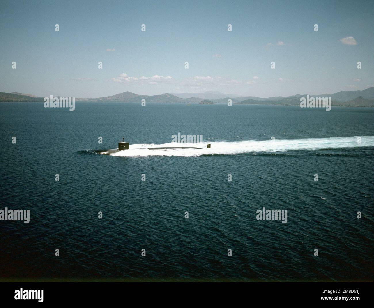 A port beam view of the nuclear-powered submarine USS OMAHA (SSN 692 ...