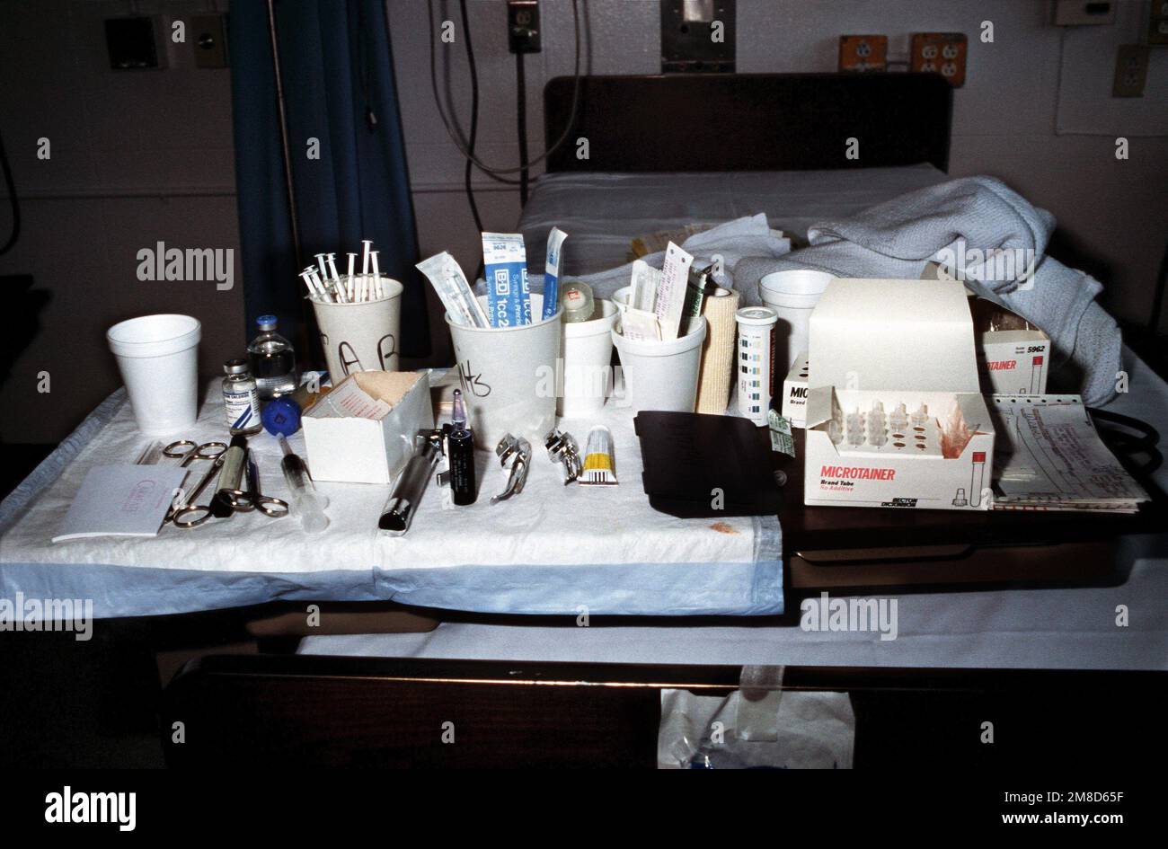 Medical supplies are placed on a tray near the bed in the Intensive ...