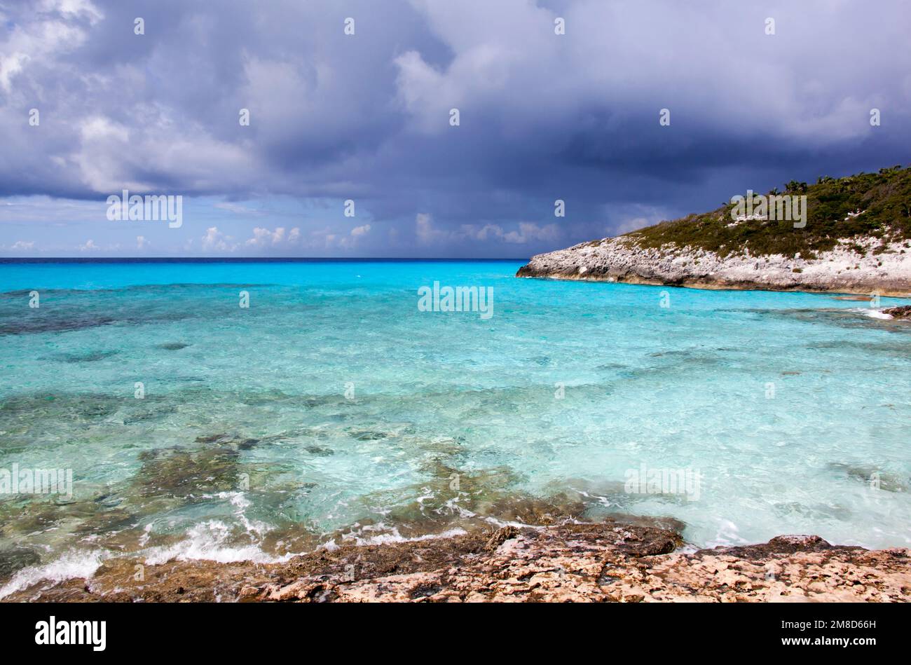 The contrastive scenery with bright turquoise color water and rainy ...