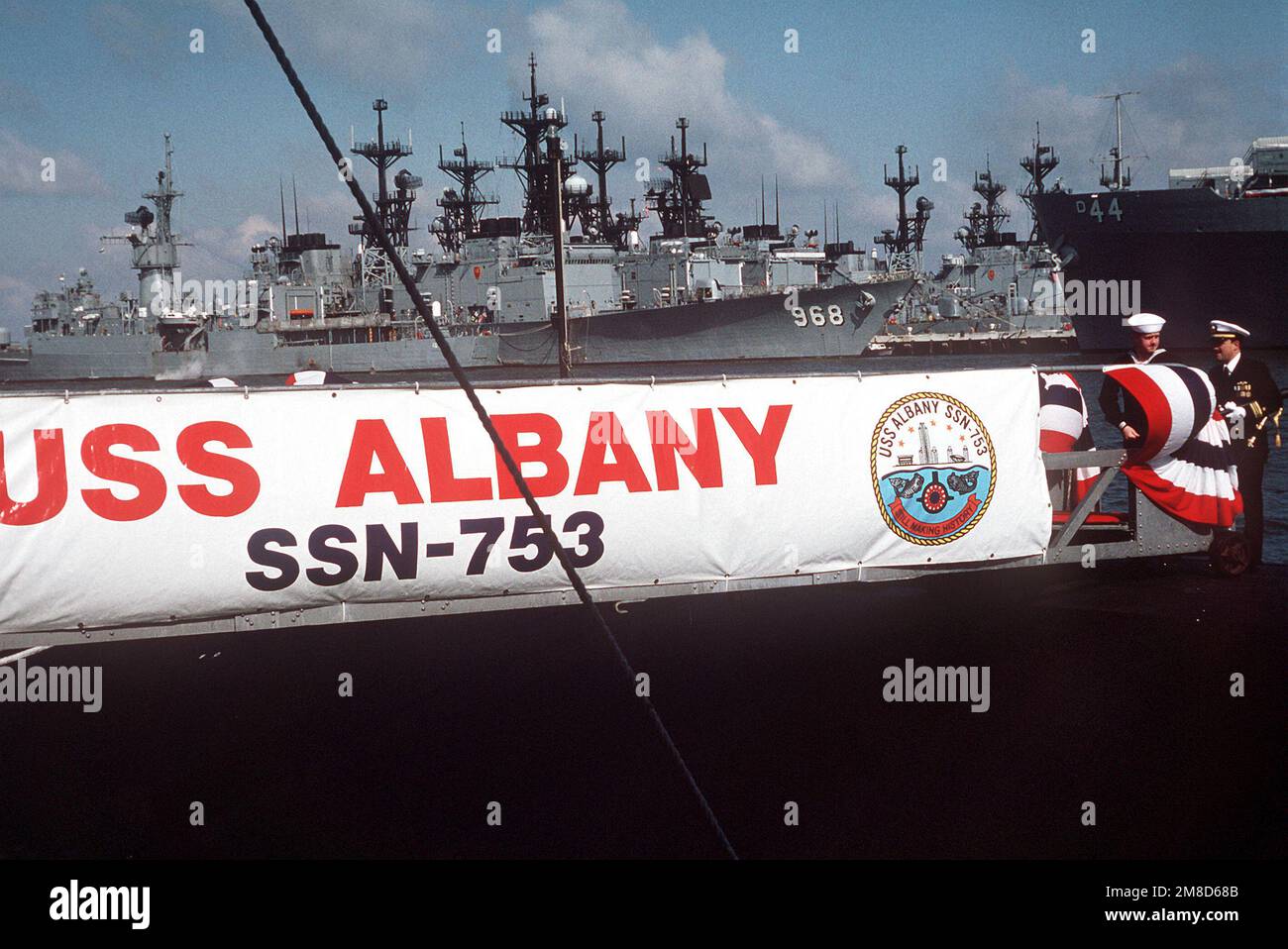 A crewman and officer of the deck stand by on the brow of the nuclear ...