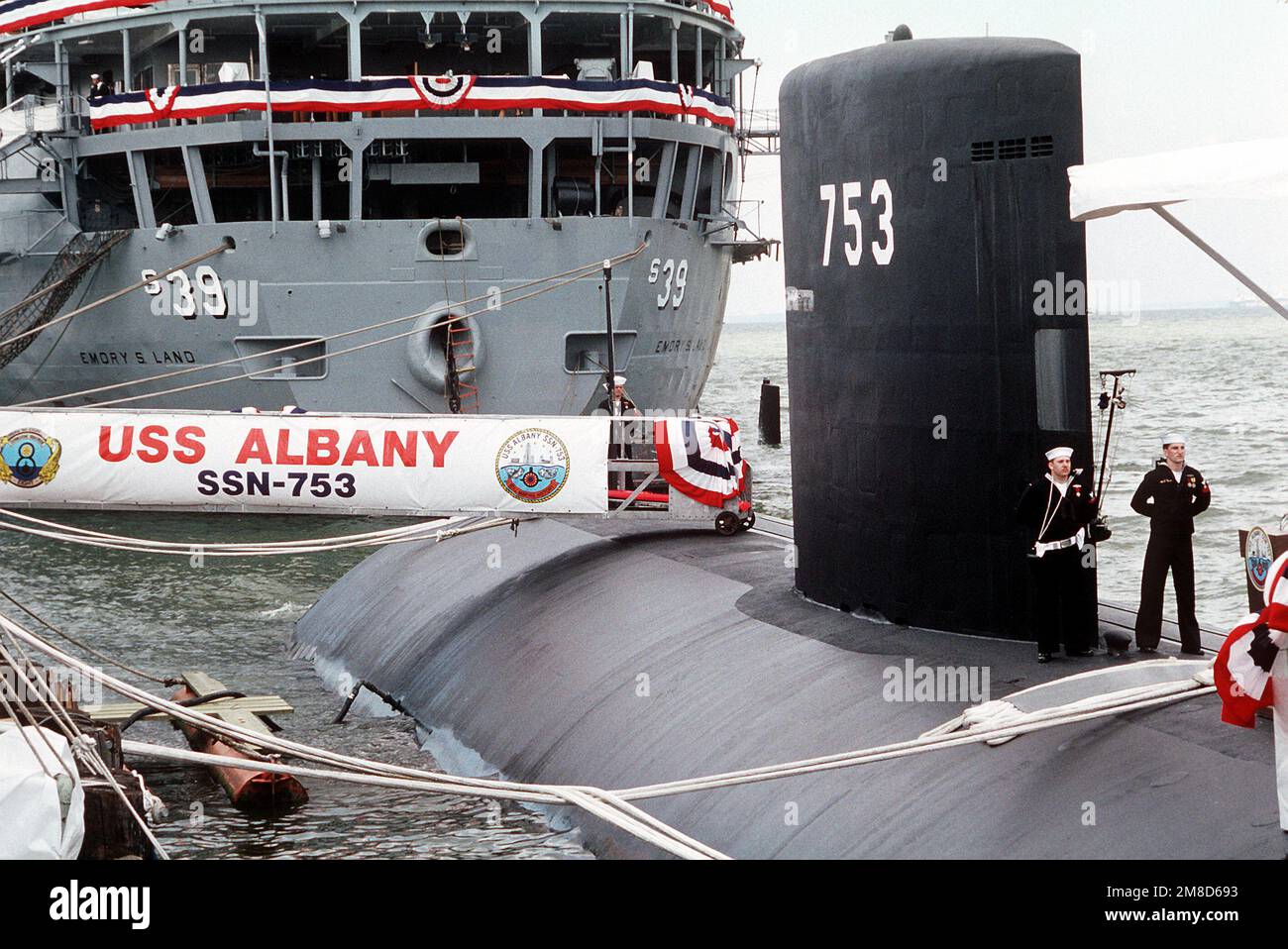Crew members stand by in preparation for setting the first watch aboard ...