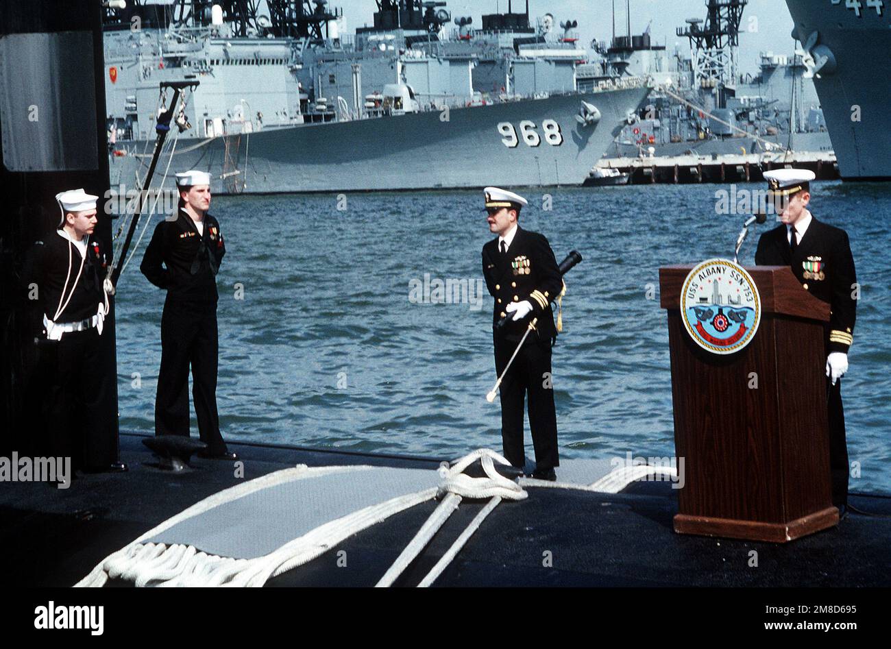 The officer of the deck prepares to set the first watch aboard the ...