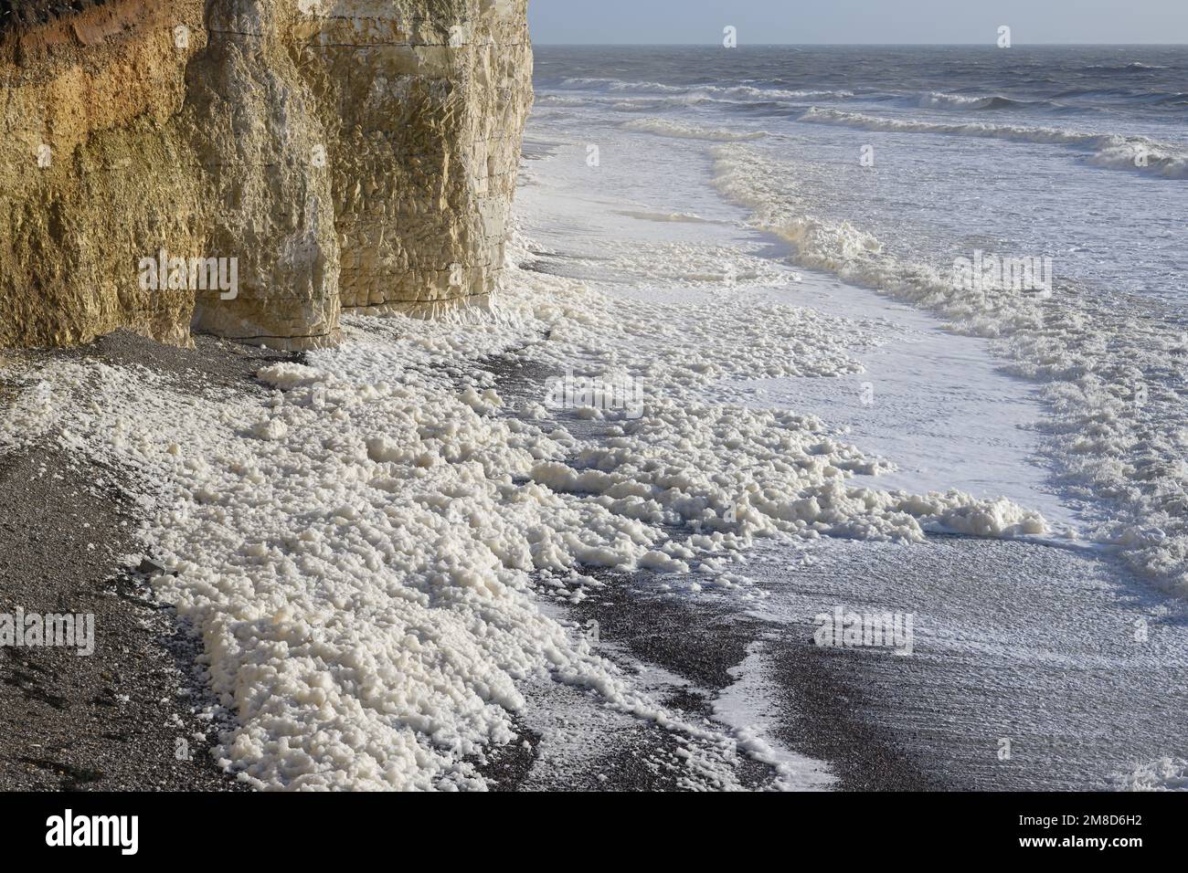 Sea Foam on the beach at Beachy Head, East Sussex, UK Stock Photo - Alamy