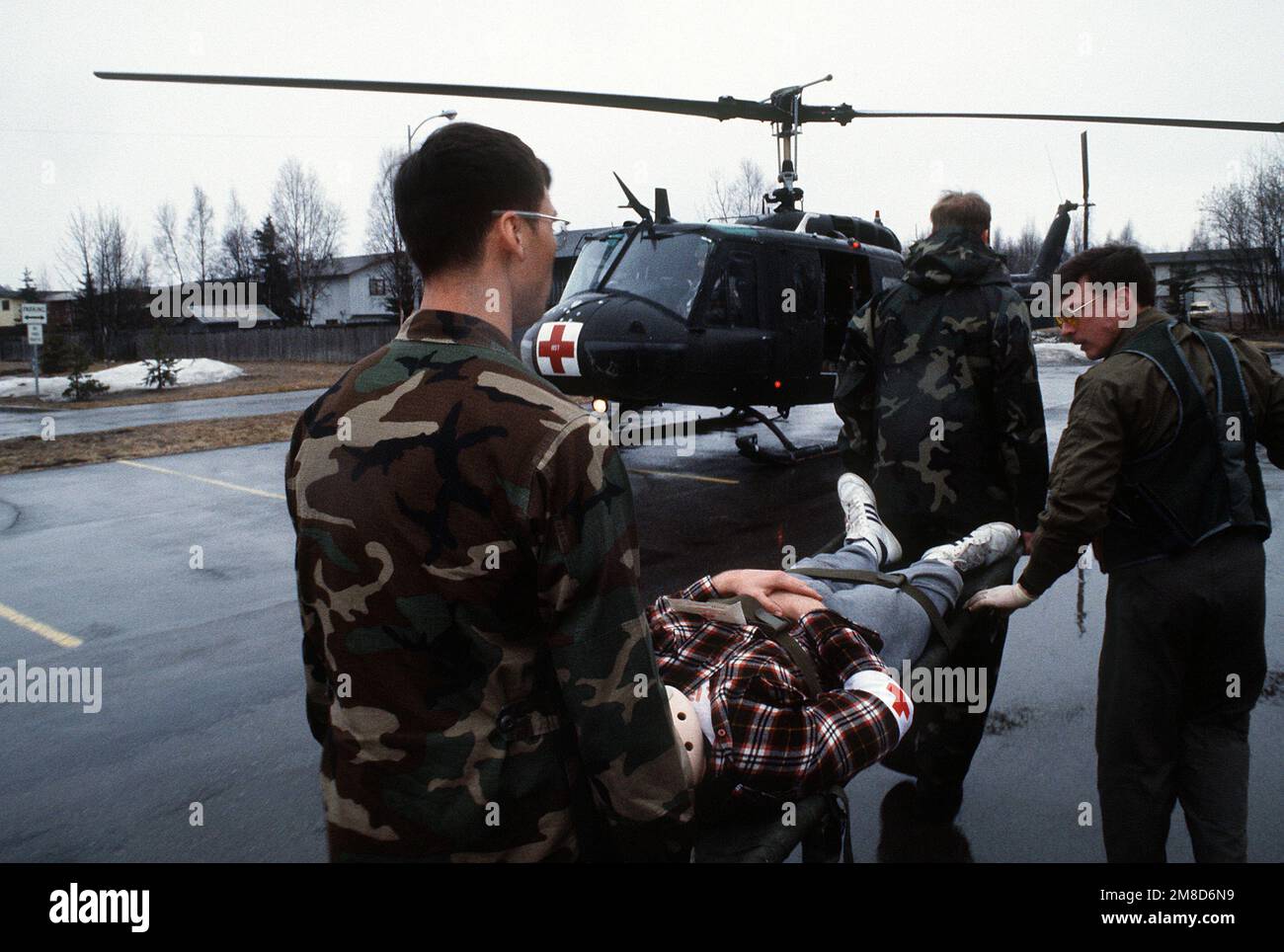 Medical personnel of the Alaska Army National Guard carry an earthquake ...