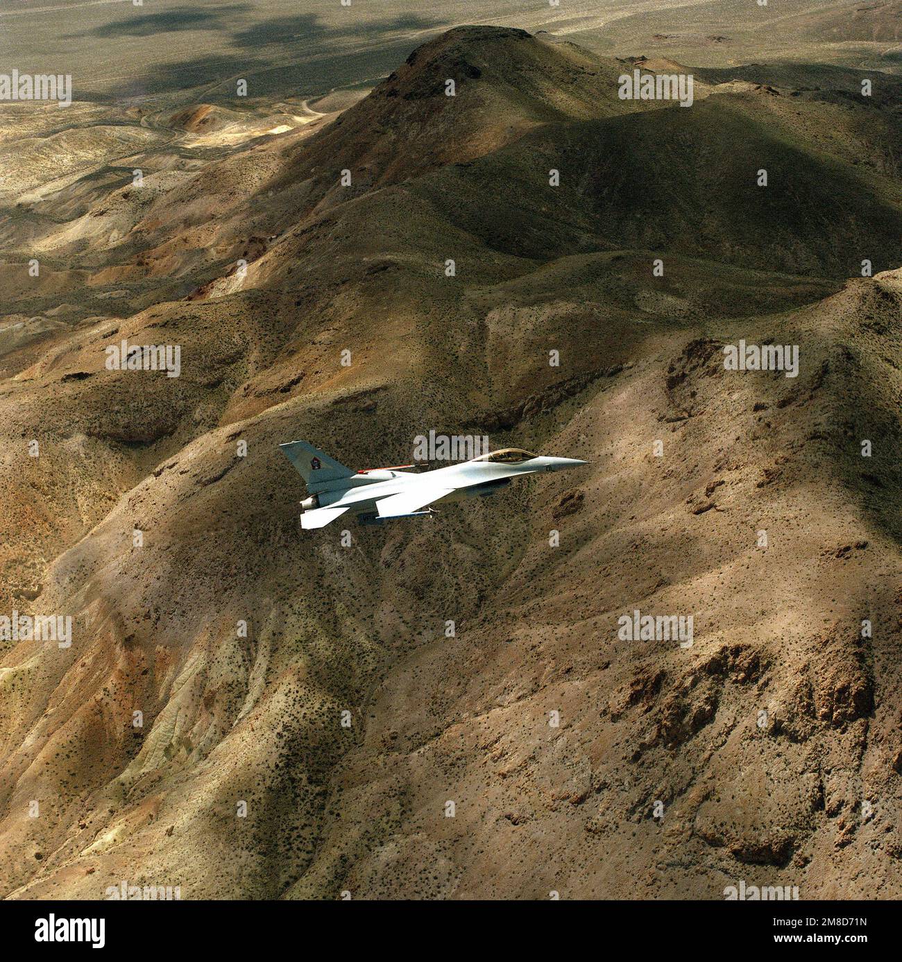 A Fighter Squadron 43 (VF-43) F-16N Fighting Falcon aircraft passes ...