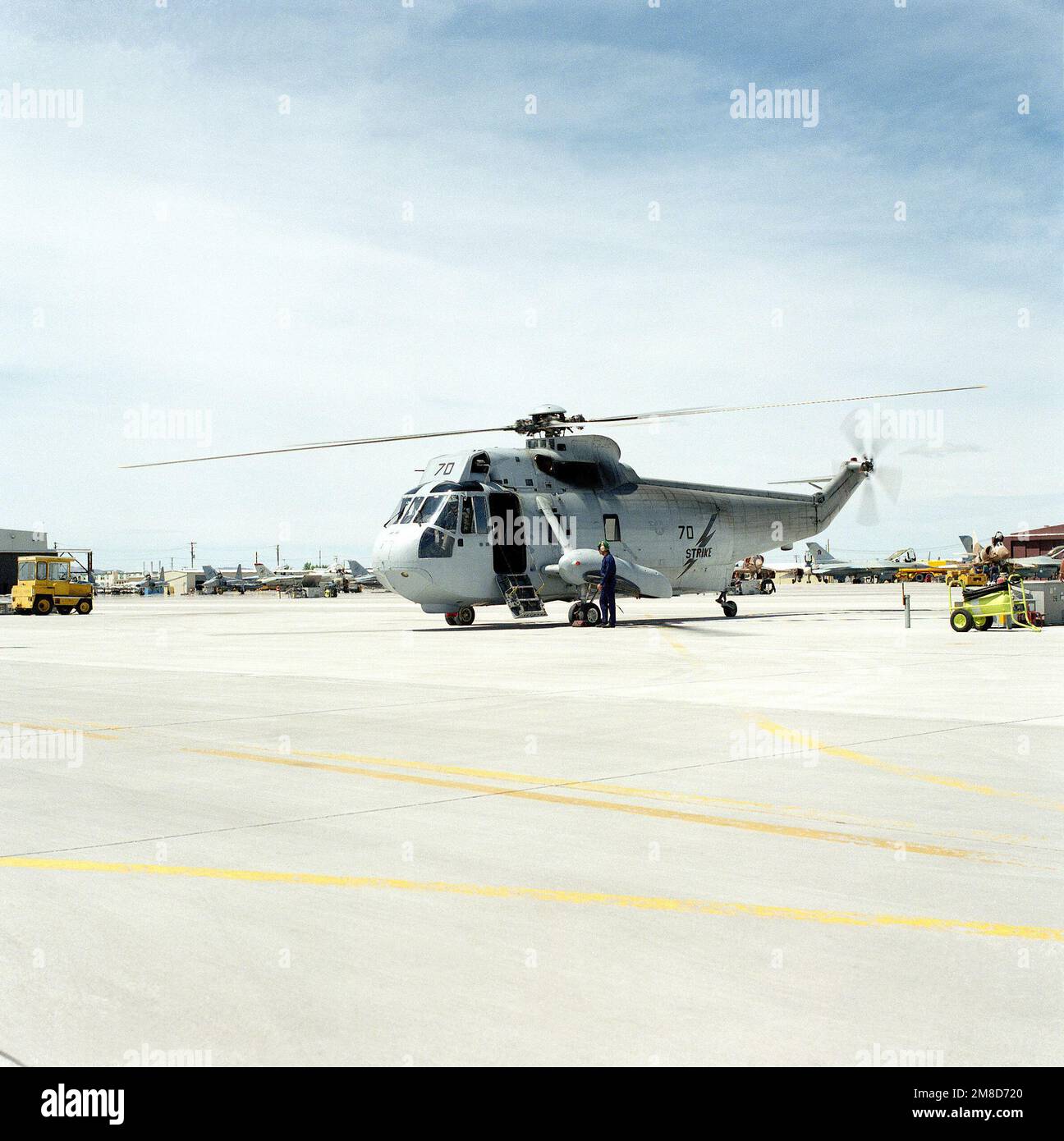 A Strike Warfare Center HH-3A Sea King helicopter manned by an air crew ...
