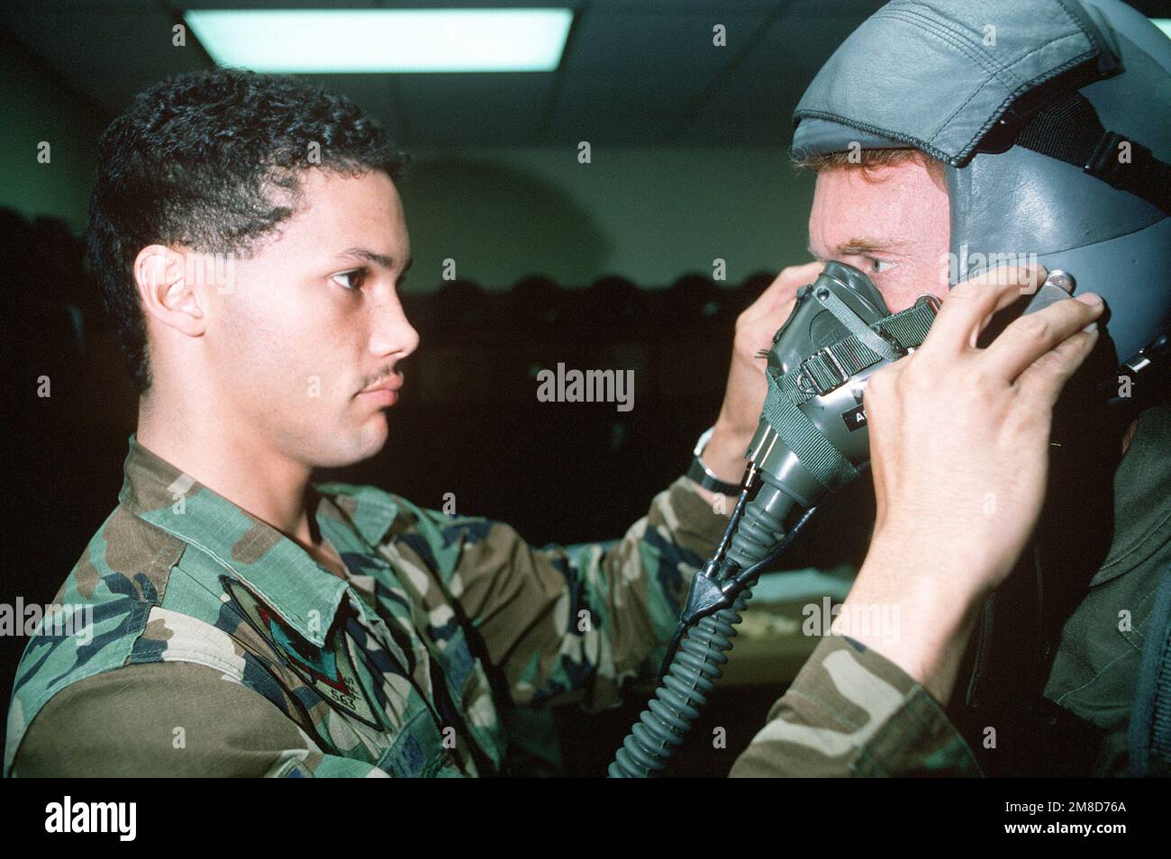 SGT Simon Ballard of the 563rd Tactical Fighter Squadron checks the ...