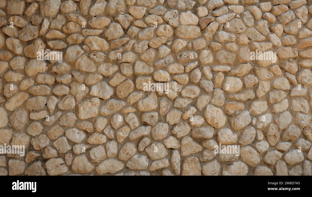 Stone wall rounded stones hi-res stock photography and images - Alamy