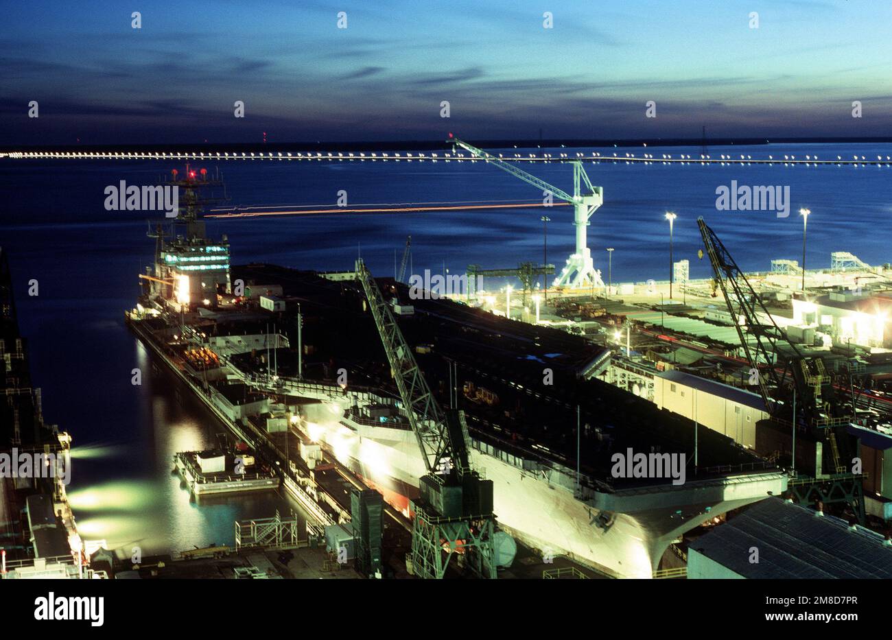 The nuclear-powered aircraft carrier USS ABRAHAM LINCOLN (CVN-72) lies ...