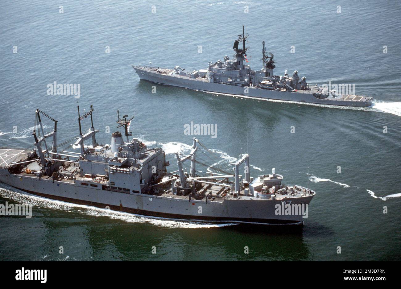 The amphibious cargo ship USS EL PASO (LKA 117), foreground, passes the ...