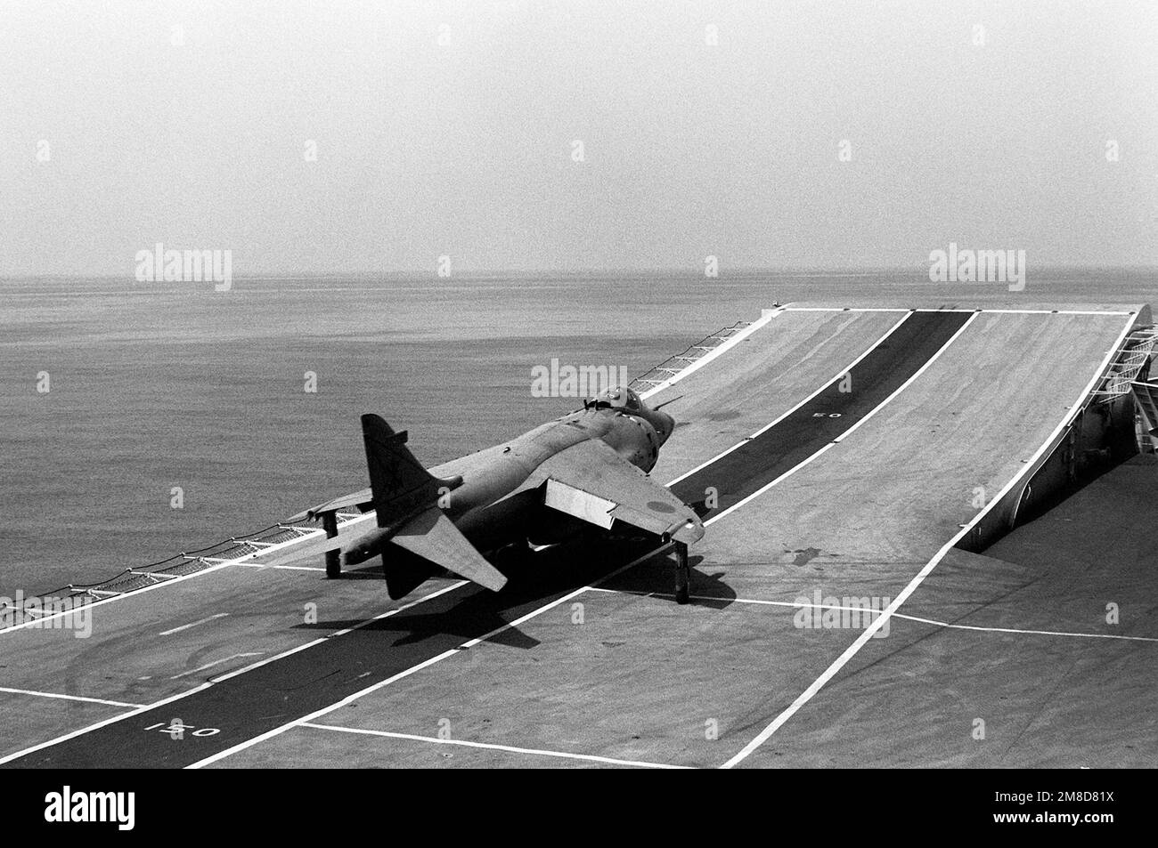 An FRS. Mark 1 Sea Harrier aircraft makes its takeoff roll along the ...