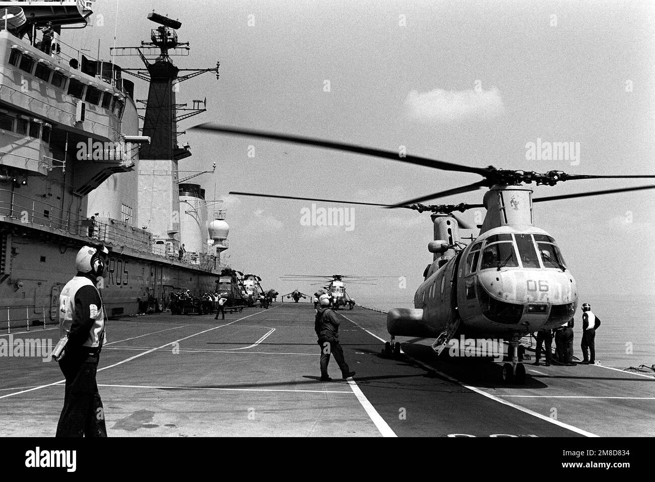 Flight deck crewmen aboard the British light aircraft carrier HMS ...
