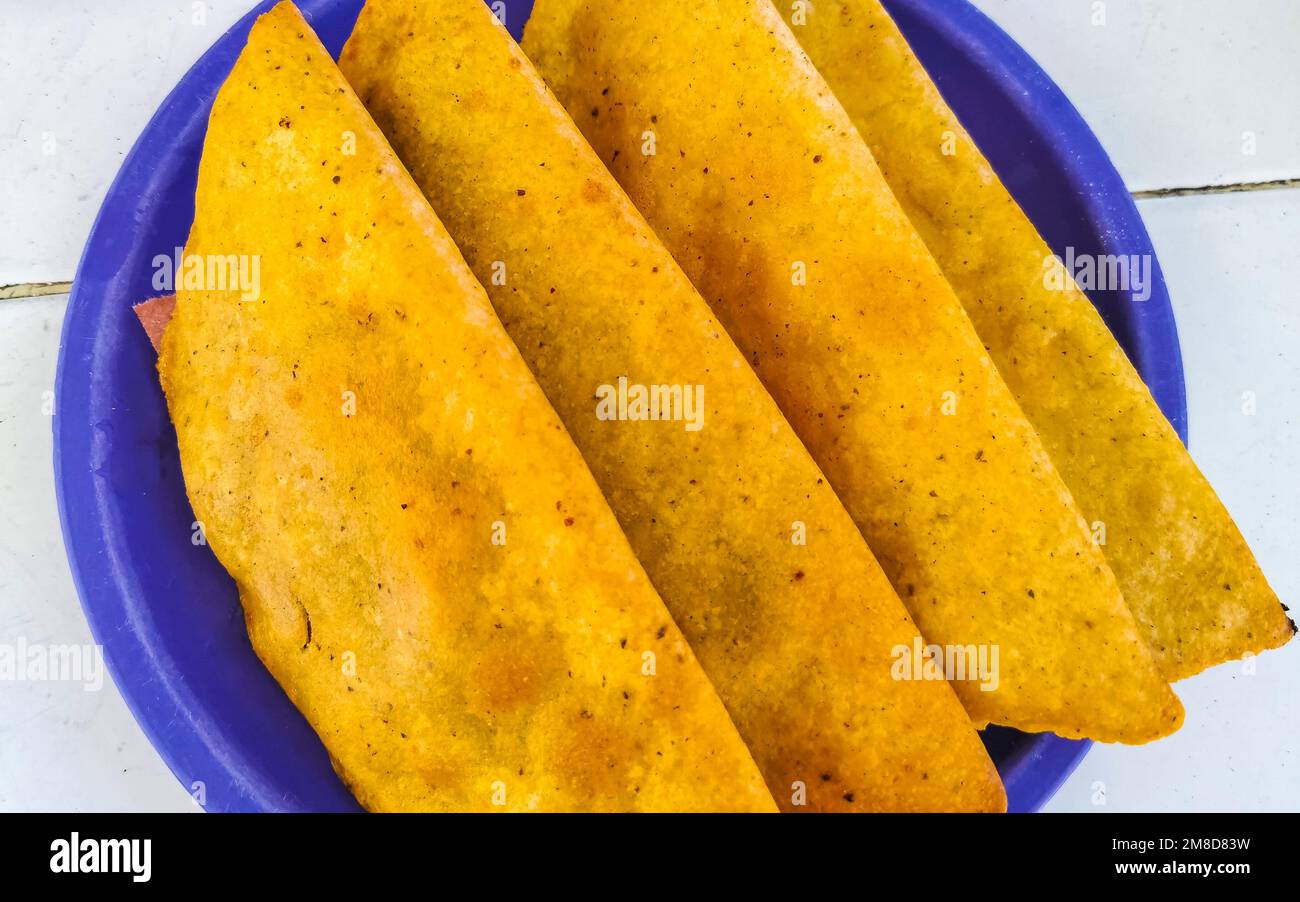 Mexican empanada on blue plate white background from Playa del Carmen ...