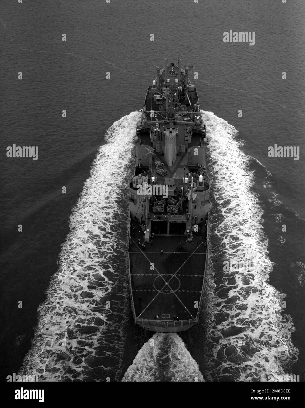 An aerial stern view of the ammunition ship USS SHASTA (AE-33) underway ...