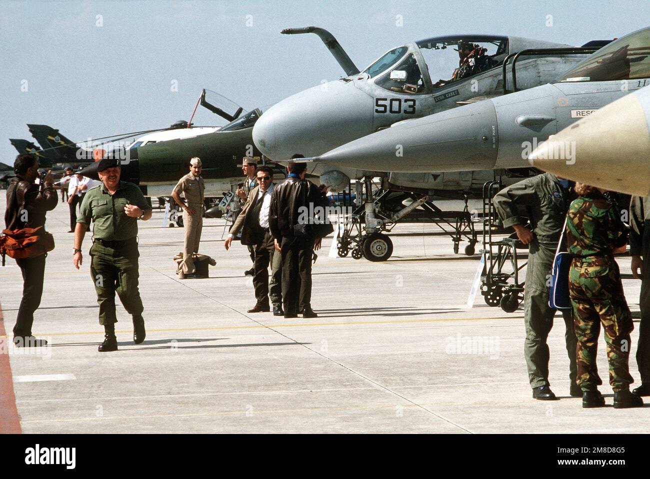 Members of the Italian press gather to photograph an A-6E Intruder ...