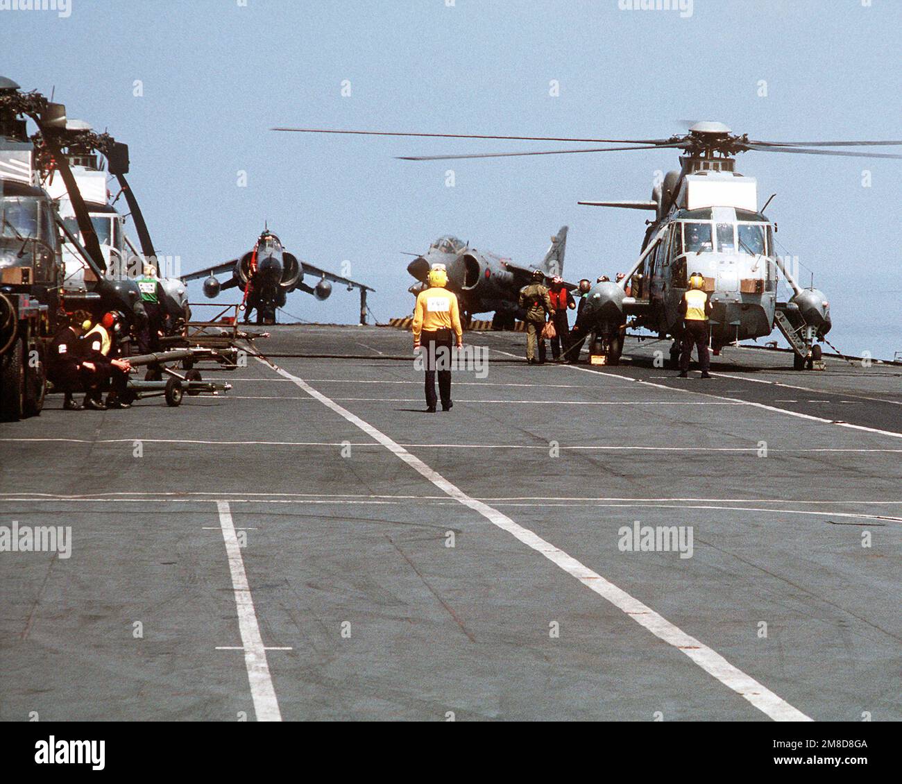 Flight deck crew members gather around a British Royal Navy HAS Mark 5 ...