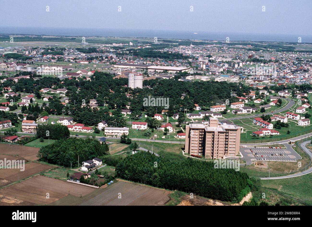 An aerial view of a portion of the base and the surrounding city of ...