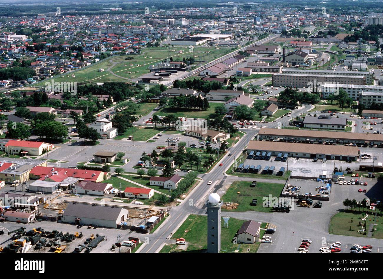An aerial view of a portion of the base and the surrounding city of ...