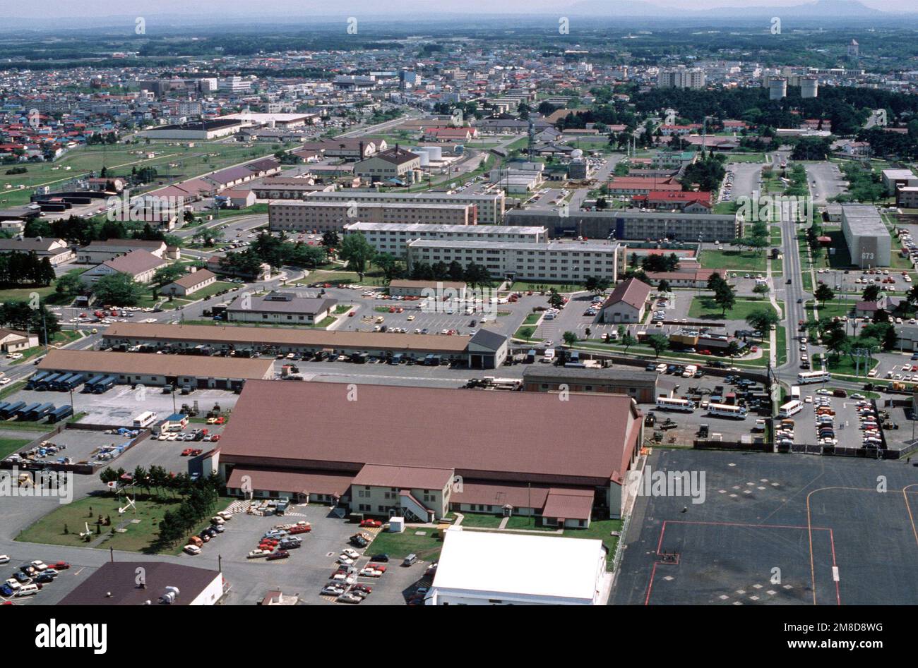 An aerial view of a portion of the base and the surrounding city of ...