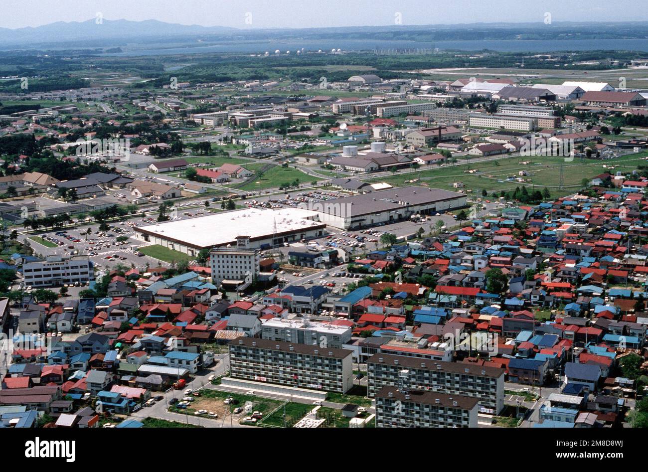 An aerial view of a portion of the base and the surrounding city of ...