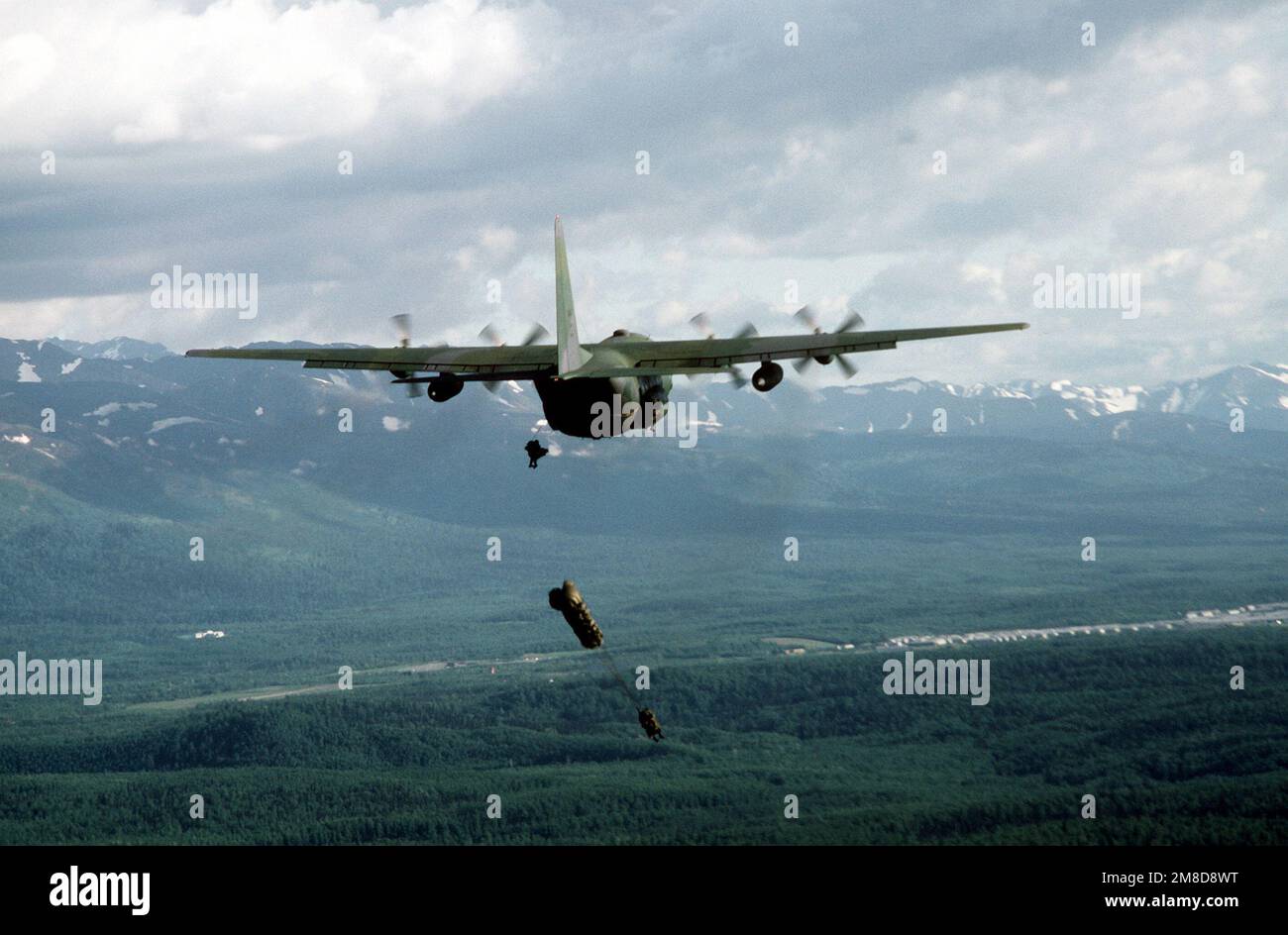 A 17th Tactical Airlift Squadron C-130 Hercules aircraft drops ...