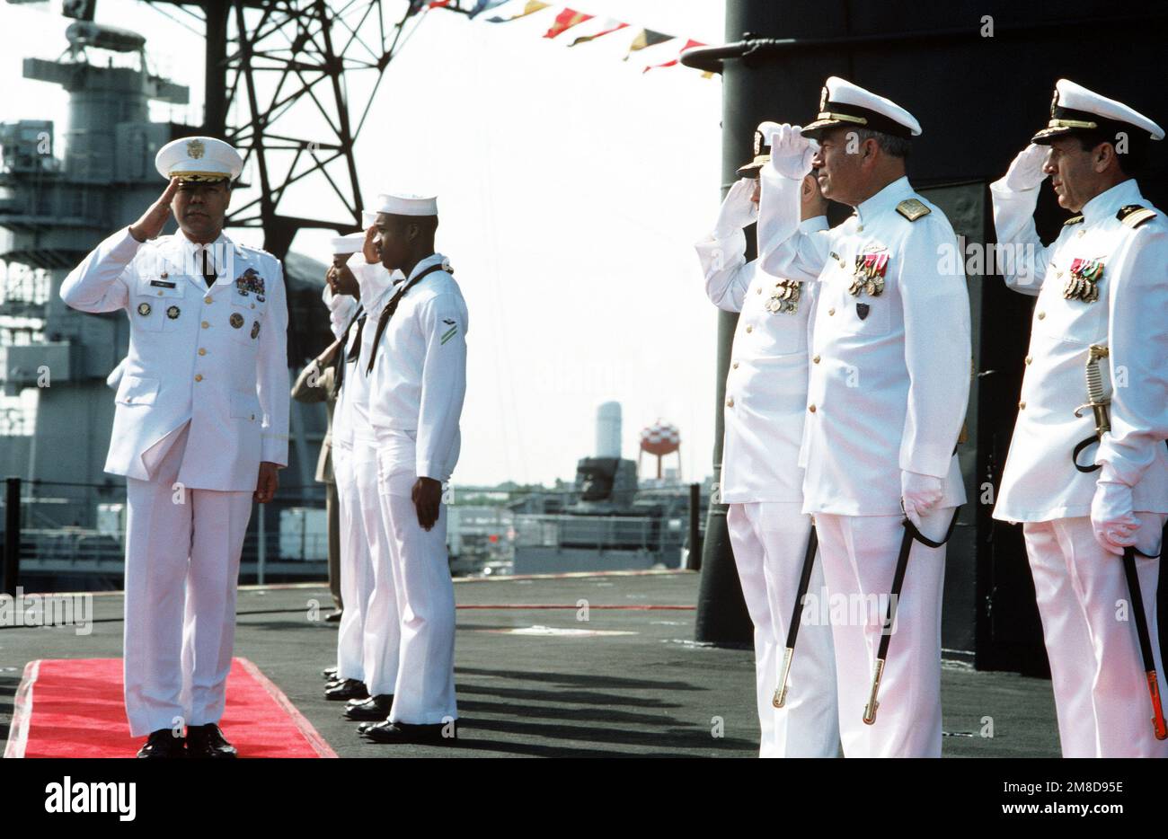 Admiral Frank B. Kelso II and other officers salute as General Colin L ...