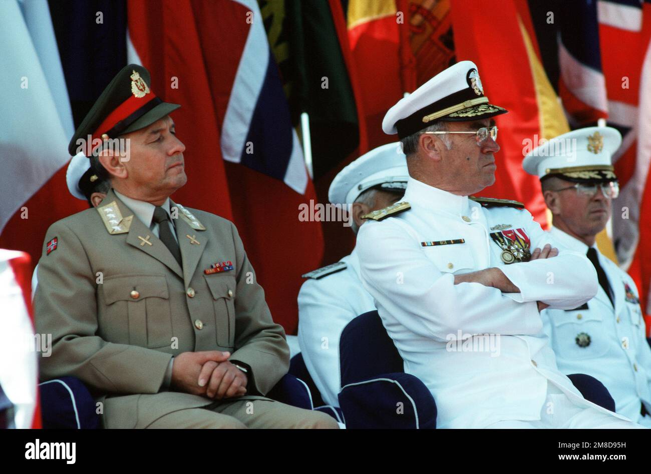 General Vigleik Eide, Chairman, NATO Military Committee, listen to a ...
