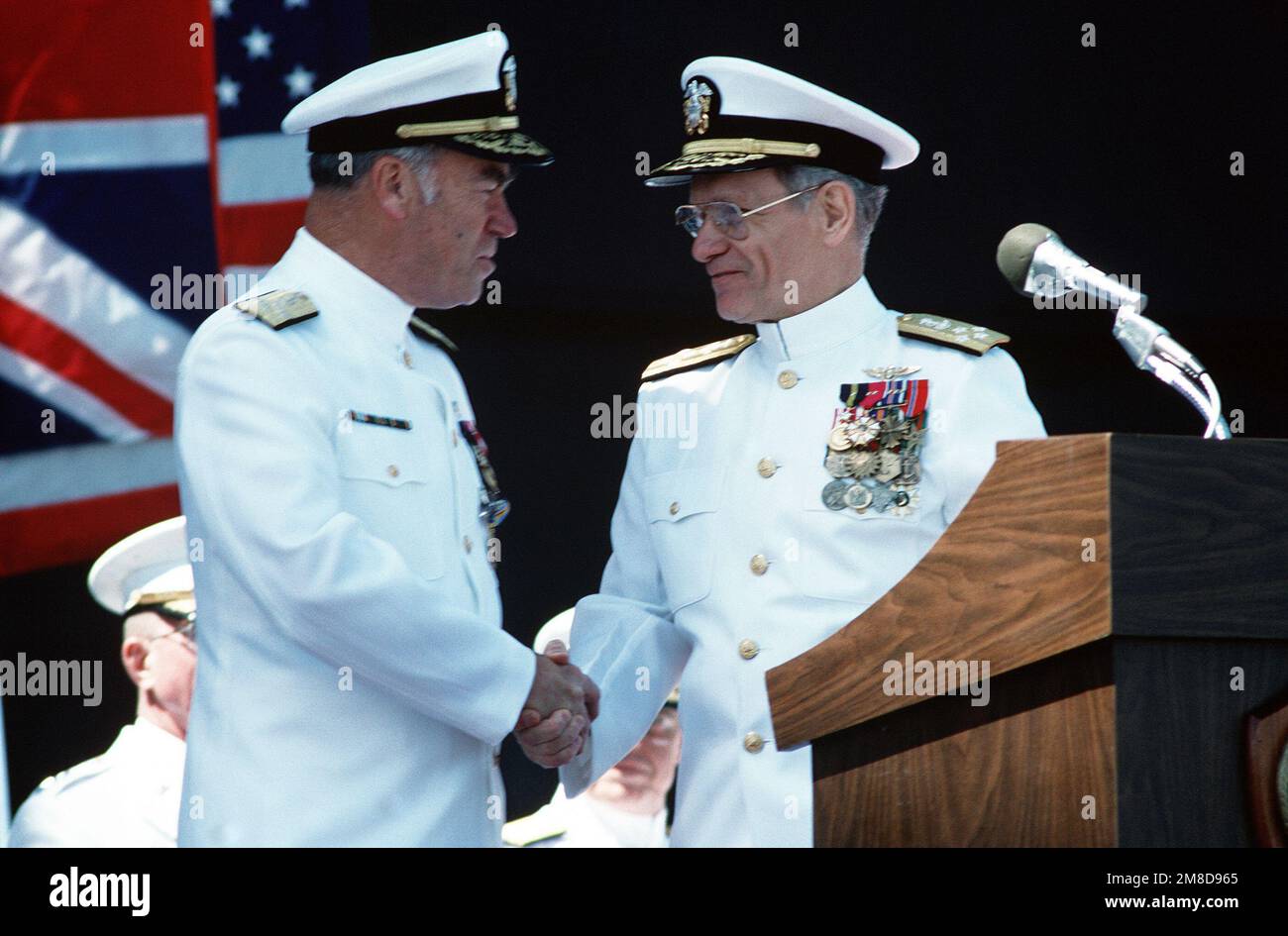Admiral (ADM) Frank B. Kelso II congratulates ADM Leon A. Edney during ...