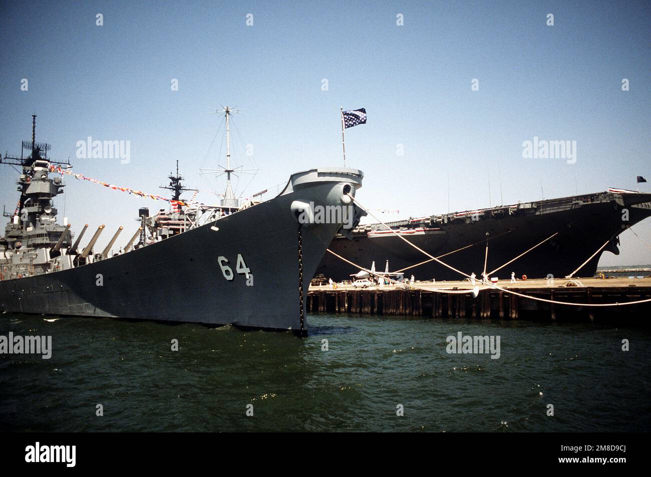 Flying a union jack on its bow, the battleship USS WISCONSIN (BB 64 ...