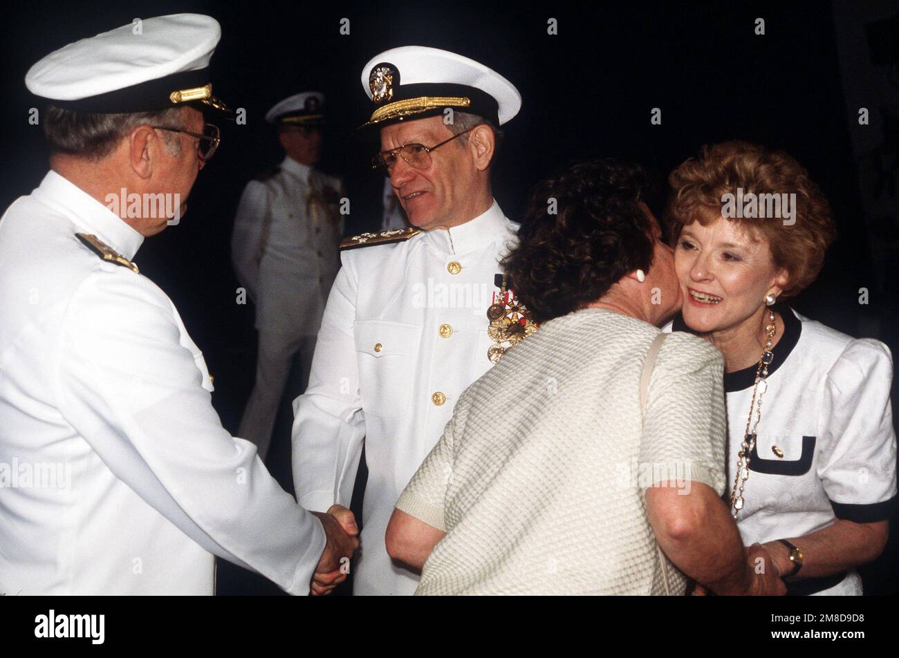 Admiral (ADM) Leon A. Edney and his wife are congratulated at the ...