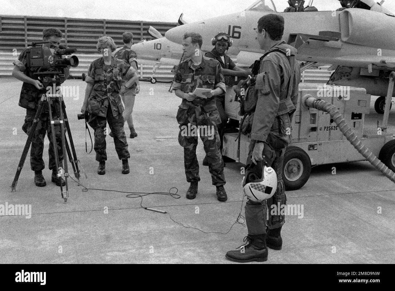 A video cameraman films the pilot of a Fleet Composite Squadron 5 (VC-5 ...