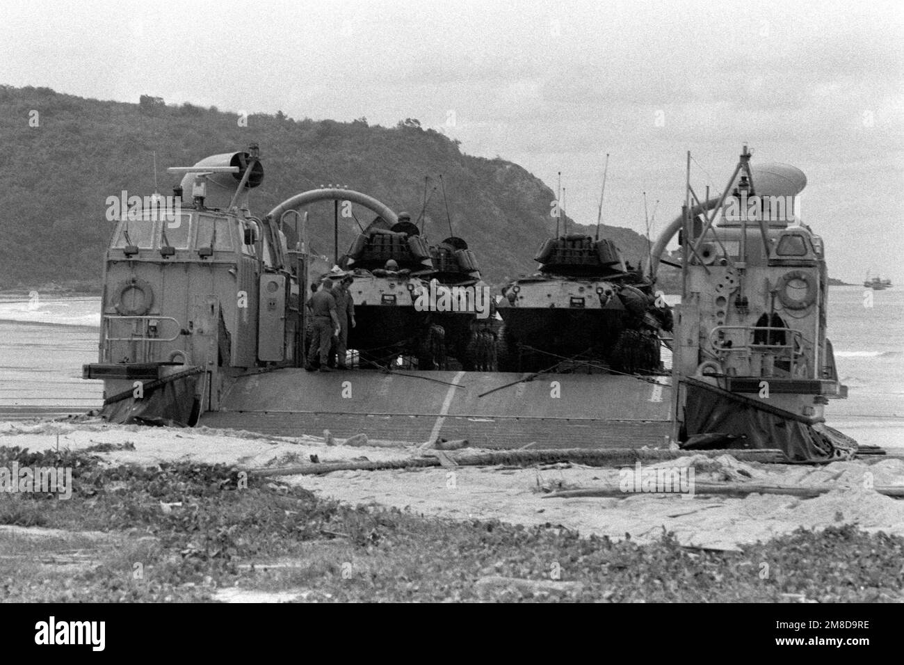 LAV-25 light armored vehicles are readied for offloading from an air ...
