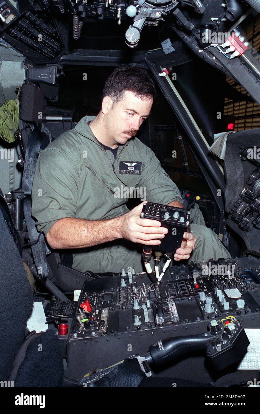 SGT Raymond L. Dowdy installs a piece of communications equipment in a ...