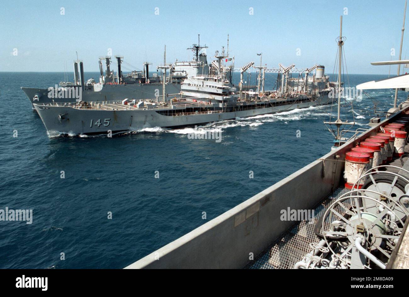 The fleet oiler USNS HASSAYAMPA (T-AO 145) steams between the ...