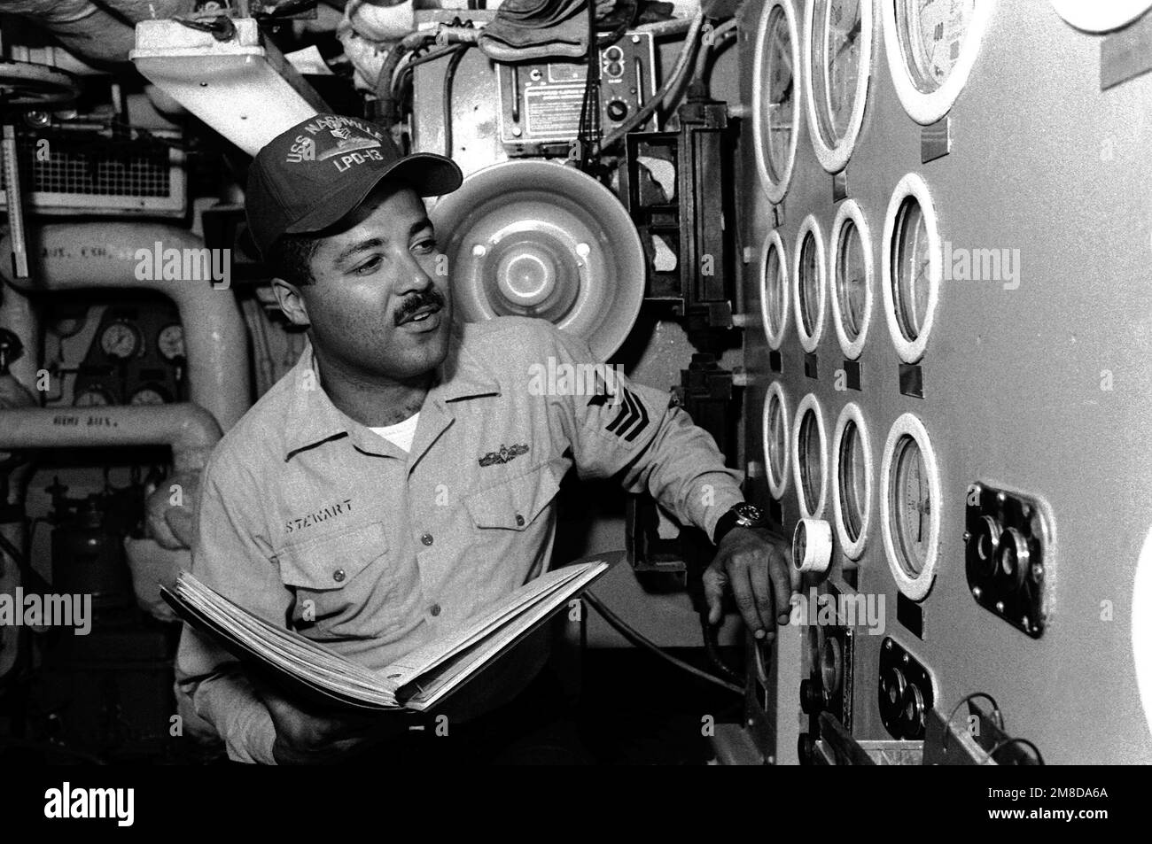 Boiler Technician 1ST Class Fred L. E. Stewart checks the boiler gauges ...