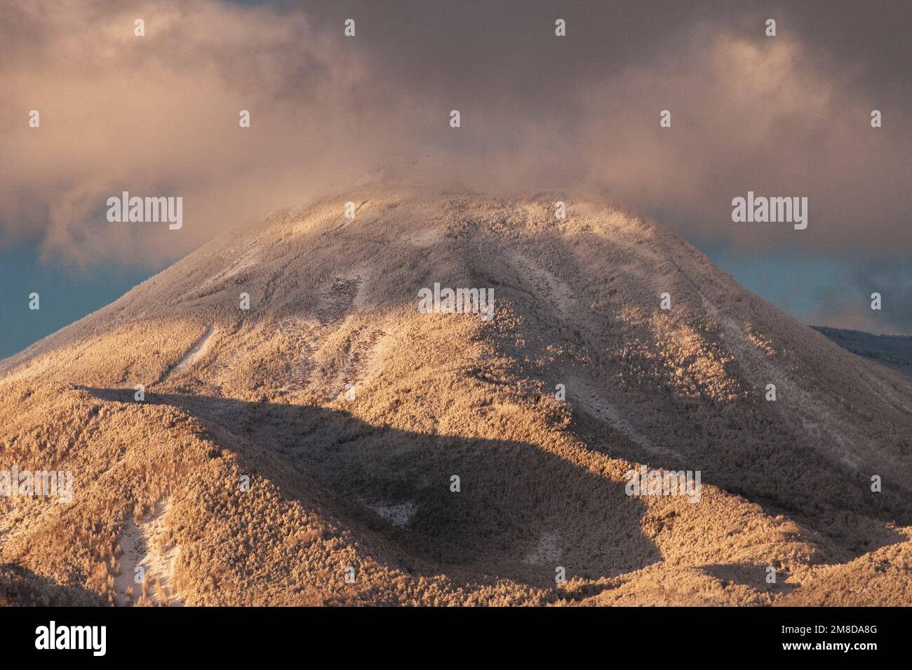 Mount Tateshina in snow in the late afternoon light, Nagano, Japan ...