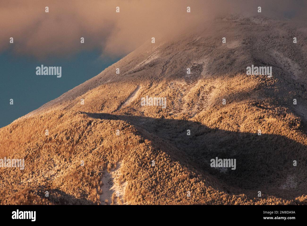 Mount Tateshina in snow in the late afternoon light, Nagano, Japan ...