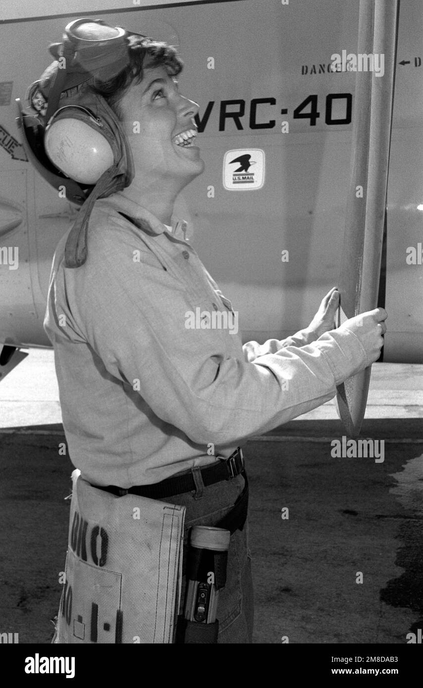 A female ground crew member services a Fleet Logistic Support Squadron ...