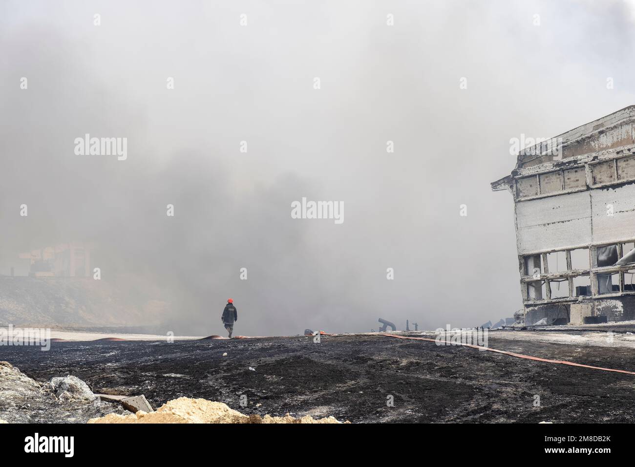 A firefighter on site, after the explosion of the oil tanks of the ...