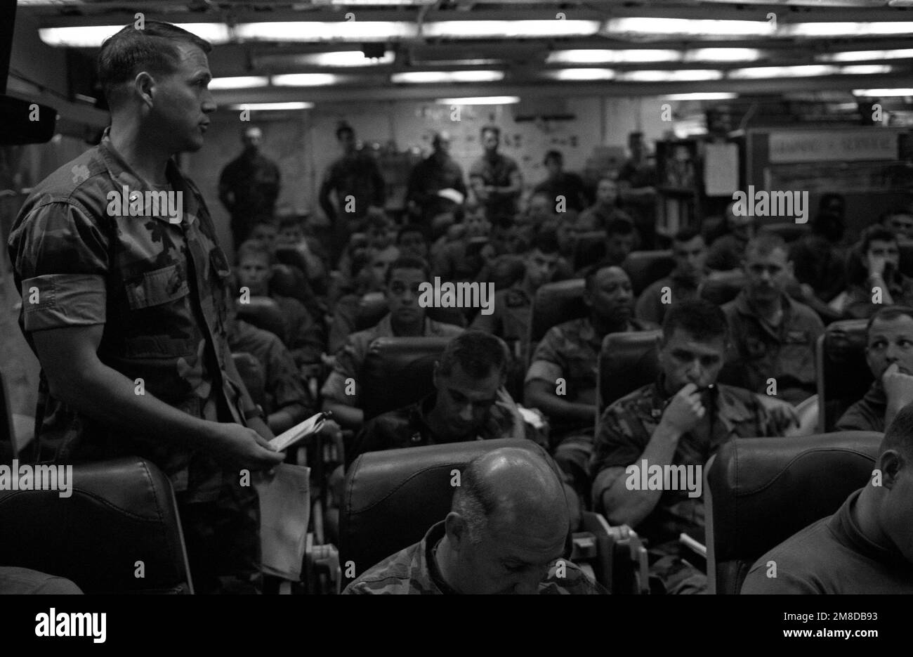 A warrant officer stands to relay some information during a pre ...