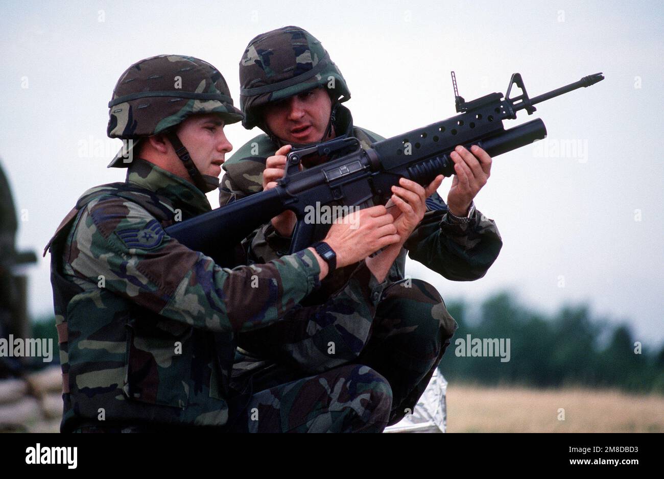 MASTER Sergeant Mike Buethie explains the operation of an M203 grenade ...