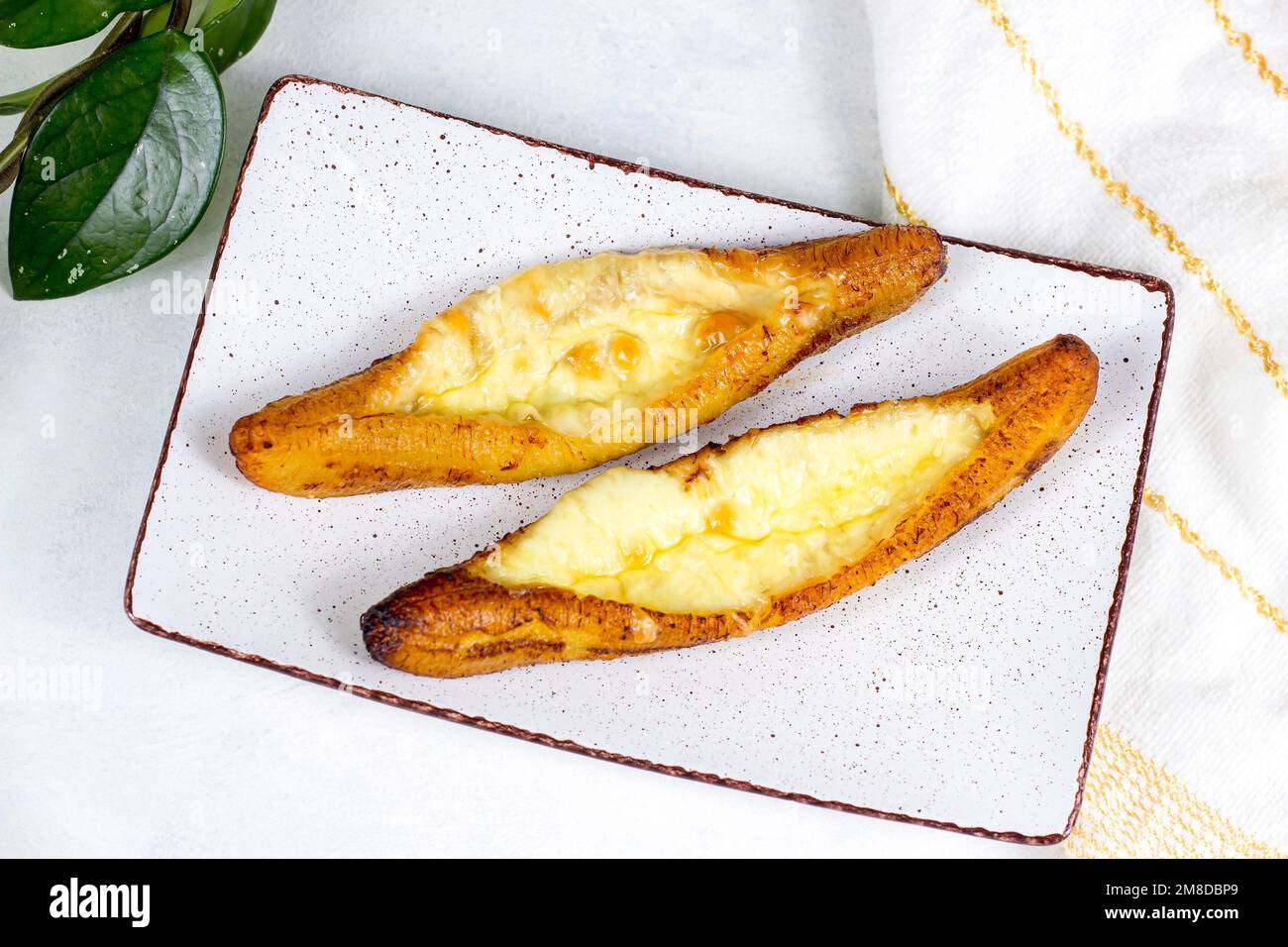 Top view of baked Ripe Plantains with Cheese (Plantain Canoe or ...