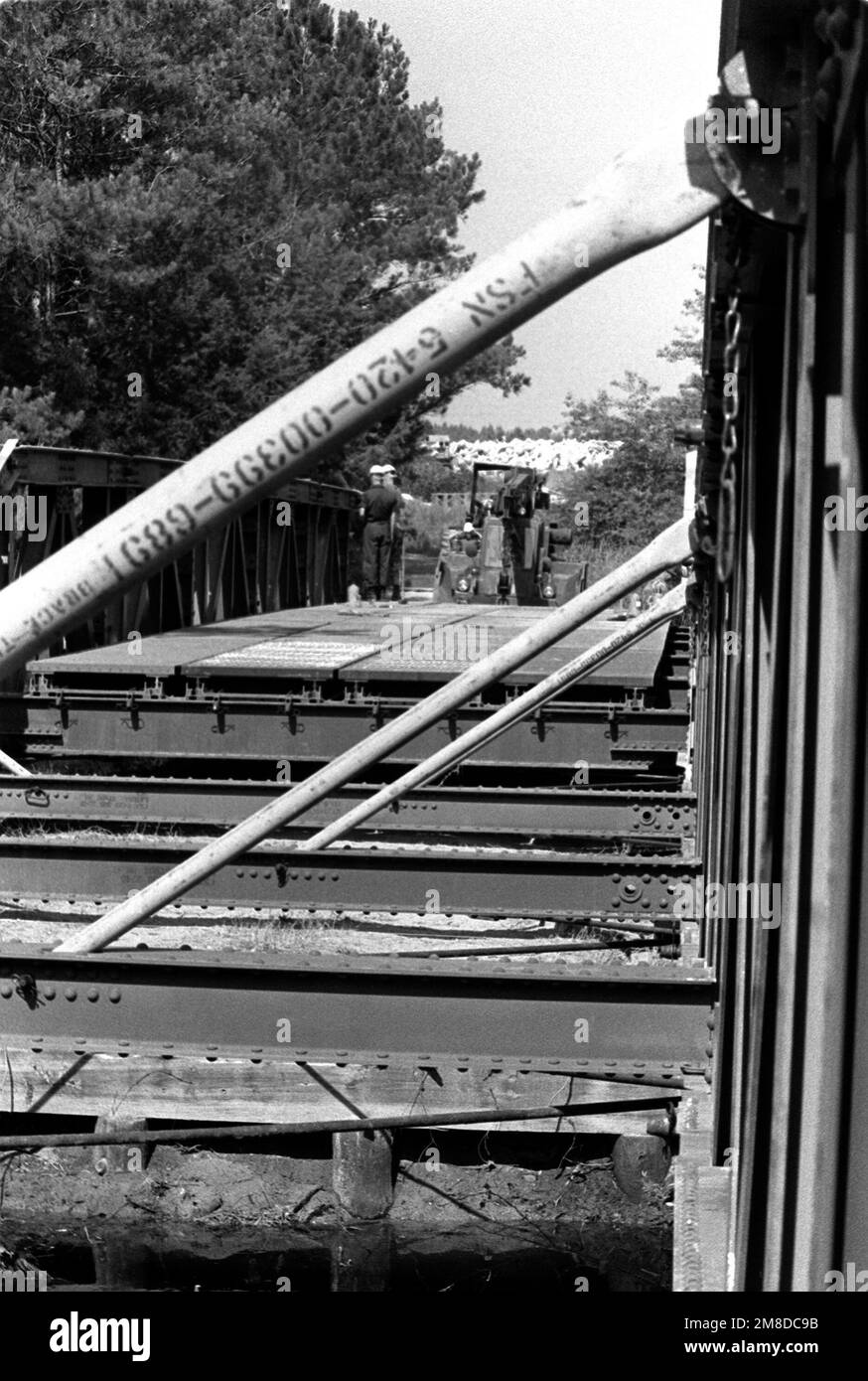 Metal rods support a section of bridge being assembled by Marine ...
