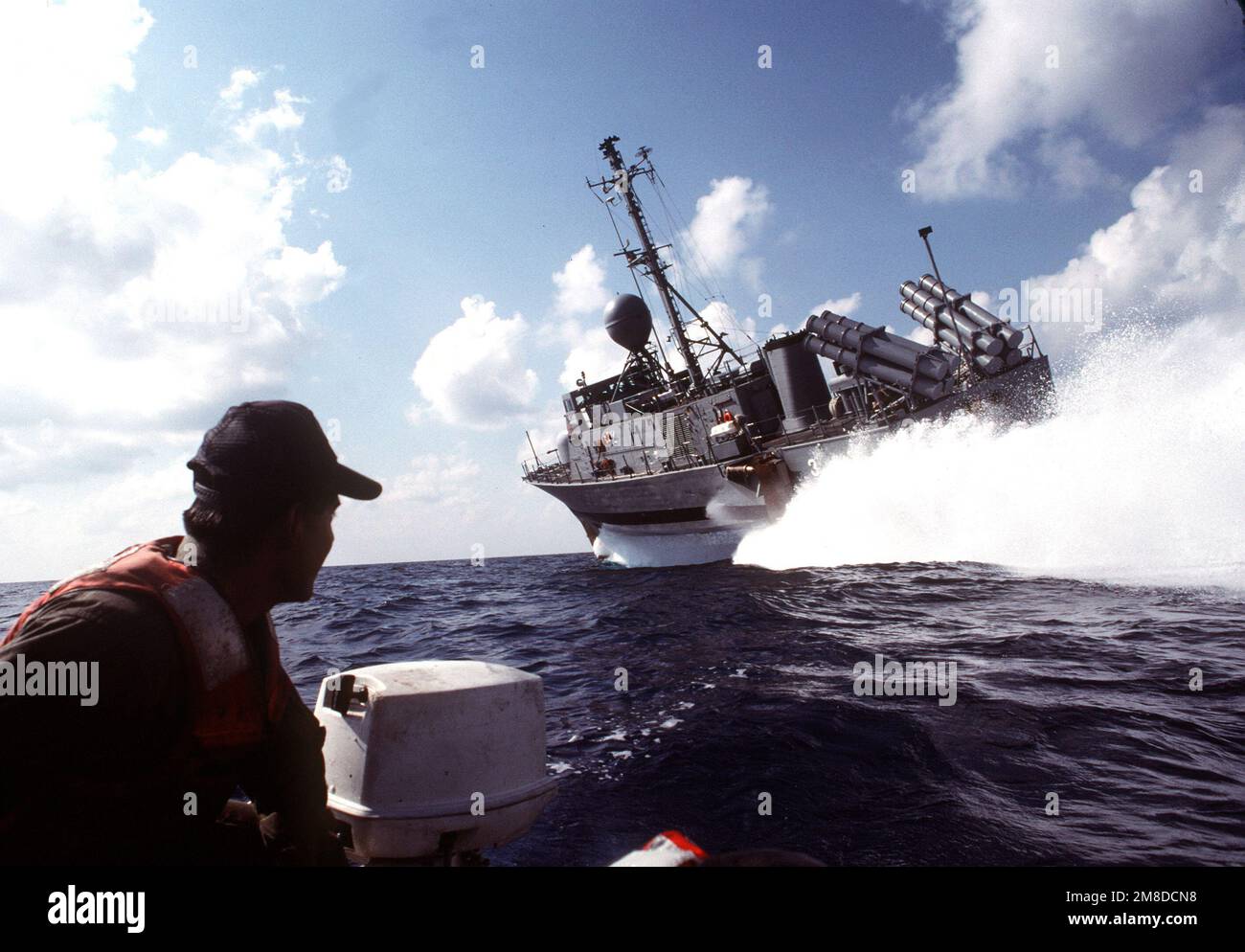 The operator of a small craft watches the hydrofoil patrol combatant ...