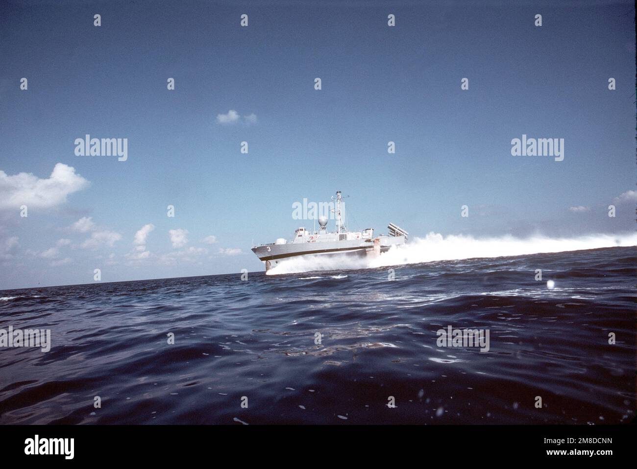 A port view of the hydrofoil patrol combatant missile ship USS TAURUS ...