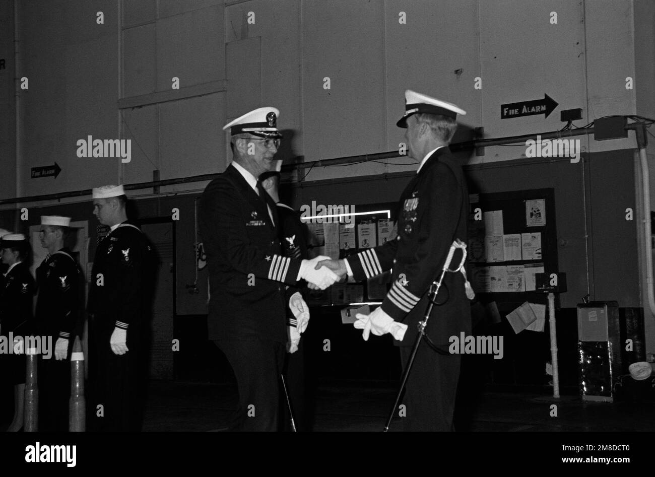 CAPT Richard E. Goolsby, left, congratulates CAPT James I. Munsterman ...