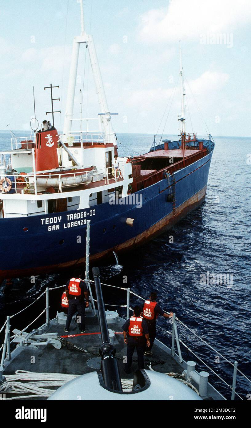 Standing in front of the Mark 75 76mm gun on the bow of a hydrofoil ...
