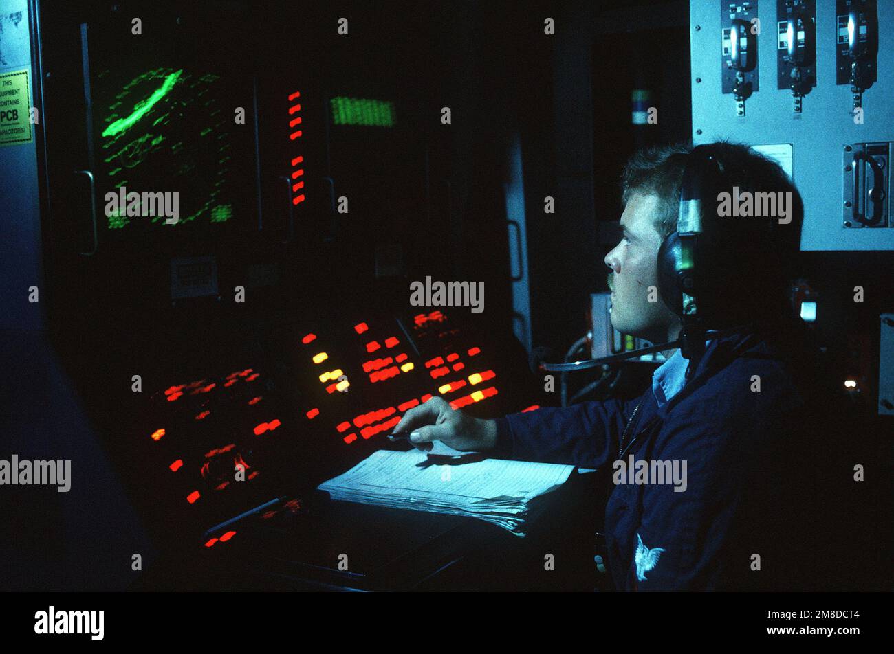 A petty officer on a Joint Task Force 4 drug interdiction mission mans ...