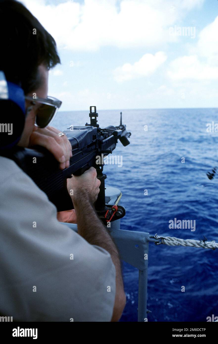 A member of a Joint Task Force 4 drug interdiction team fires an M60 ...